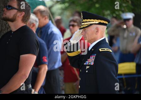 Brig. Gen. Stephen Osborn of the Iowa National Guard presents a U.S ...