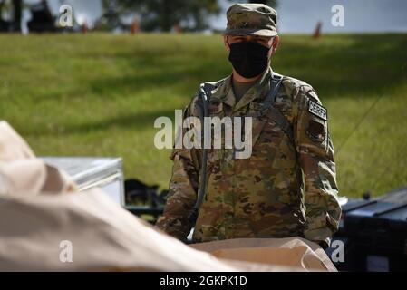 Airmen from the 142nd Force Support Squadron pitch a Tent Extendable ...