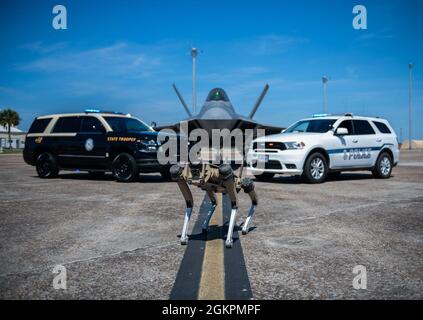 A Florida Highway Patrol car and a 325th Security Forces Squadron ...