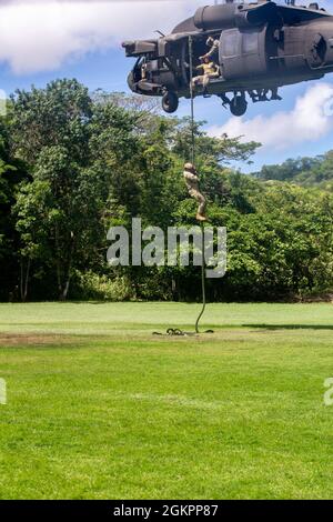 A member of the Costa Rican Police Forces fast ropes out of a U.S. Army ...