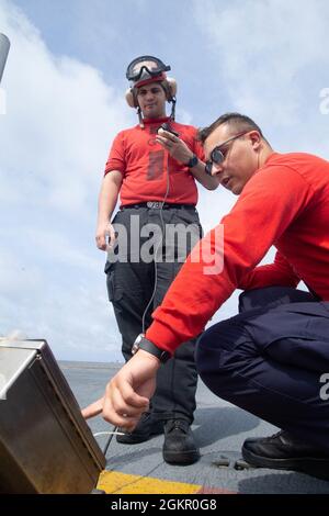 U.S. Navy Aviation Ordnanceman Airman Jessica Fulcher installs a ...