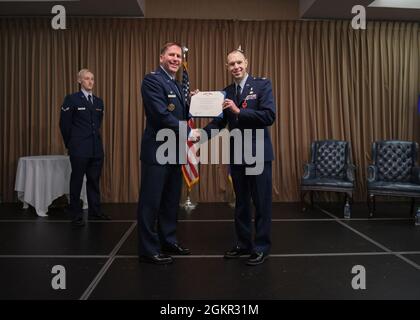 Col. Johnathan Compton, 319th Medical Group commander, passes the ...