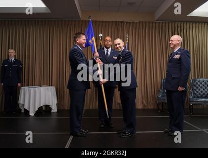 Col. Johnathan Compton, 319th Medical Group commander, passes the ...