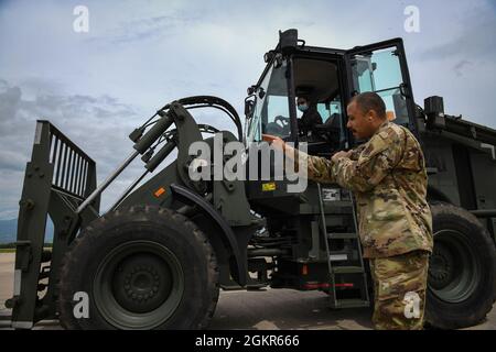 U.S. Airmen in an all-terrain 10K forklift and a Halvorsen 25K Loader ...
