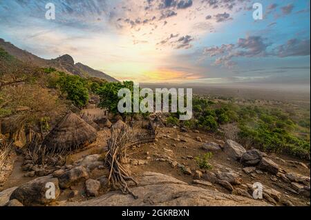 Sunset over traditional huts of the Otuho (Lotuko) tribe, Imatong ...