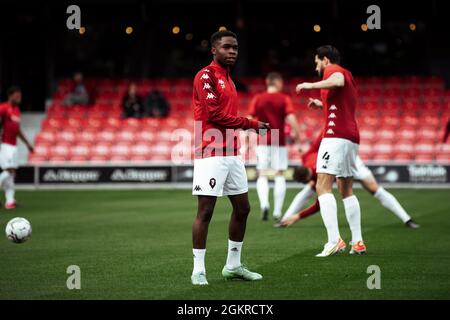Kelly Nmai of Salford City FC is tackled by Reece Hutchinson of Crewe ...