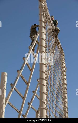 A safety looks on as Staff Sgt. Max Rees, 75th Training Division, gets ...
