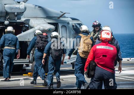 Sailors on board the US Navy's spruance class destroyer USS MOOSBRUGGER ...