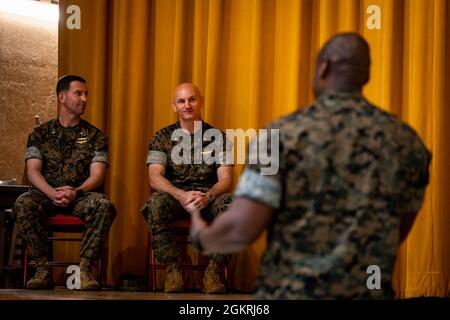 U.S. Marine Corps Col. Henry Dolberry Jr. congratulates Sgt. Maj. Joy M ...