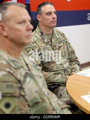 Task Force Phoenix Commander Col. Alan Gronewold, left, has a ...