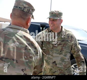Task Force Phoenix Commander Col. Alan Gronewold, left, has a ...