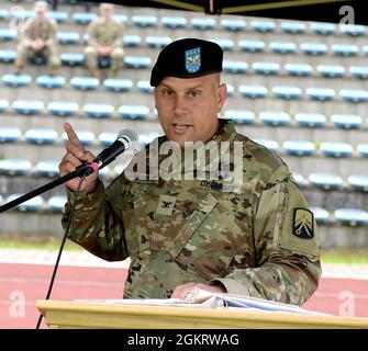 The 16th Sustainment Brigade Commander Col. Angel Estrada shakes the ...