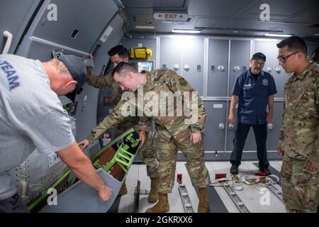 Airmen with the 605th Aircraft Maintenance Squadron perform repairs on ...