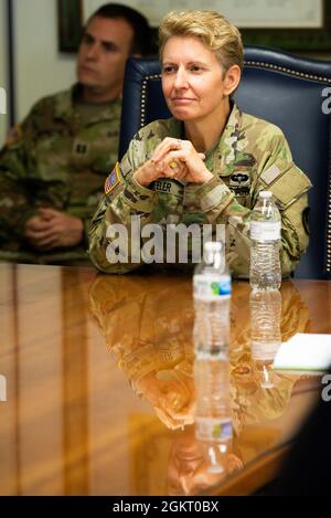 Brig. Gen. Christine A. Beeler passes the colors to Col. Justin L ...
