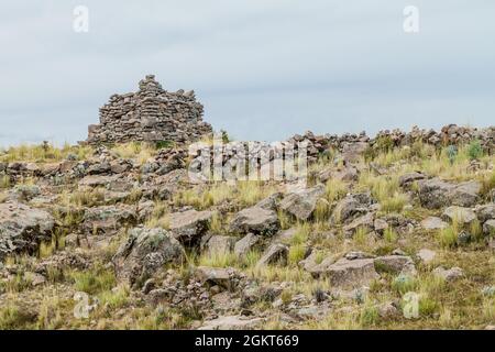 Stone wall of a temple on Pachatata hill on Amantani island in Titicaca ...