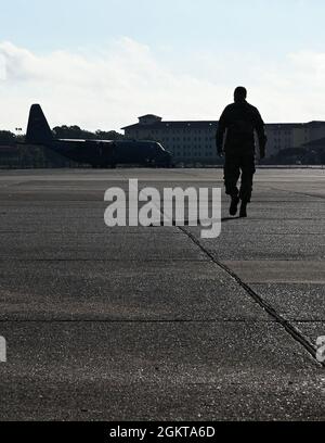 Commander of the 908th Airlift Wing, Col. Craig Drescher, left, passes ...