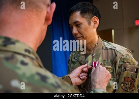 Col. Michael Fea, 51st Medical Group commander, left, awards the Legion ...