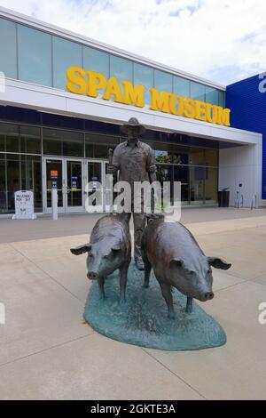 Farmer and pigs statue of Spam Museum with downtown Austin in ...