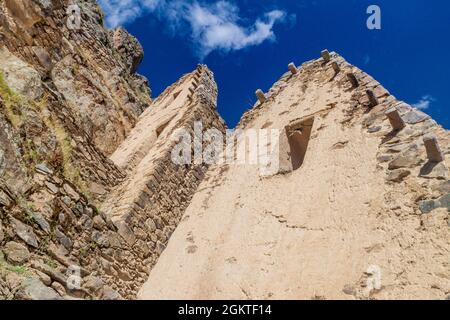 The historic Incan storehouse ruins above the town at Ollantaytambo ...