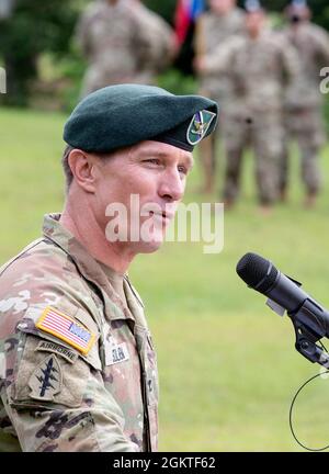 Col. Kent G. Solheim, 165th Infantry Brigade commander, left, embraces ...