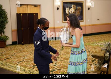 Lt. Col. Johnathan French and Lt. Col. Daniel Kim jovially embrace in a ...