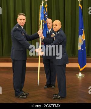 Lt. Col. Johnathan French and Lt. Col. Daniel Kim jovially embrace in a moment of brotherly ...