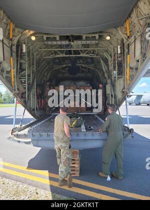 Members of the 43rd Aerial Port Squadron load a Humvee, using a K ...