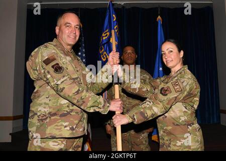 Col. Paul Toth, 90th Medical Group commander, passes the guidon to Lt ...