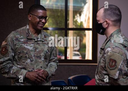 Maj. Gen. Randall Reed, Third Air Force commander, receives a haircut ...