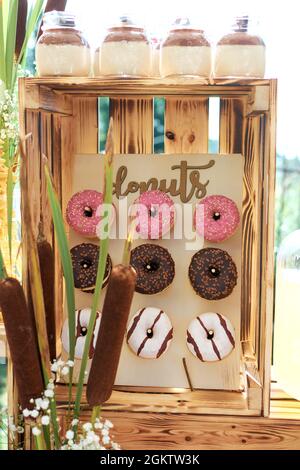 Wooden round table with coffee and desserts. Coffee break Stock Photo ...