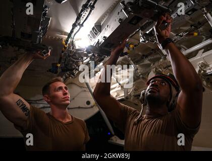 U.S. Navy Aviation Ordnanceman Airman Jessica Fulcher installs a ...