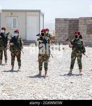 Peshmerga female soldiers run through squad movement drills at the ...
