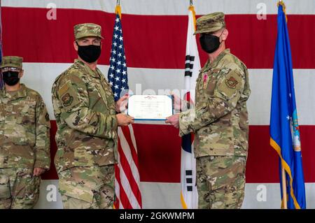 Col. Michael Fea, 51st Medical Group outgoing commander, returns a ...