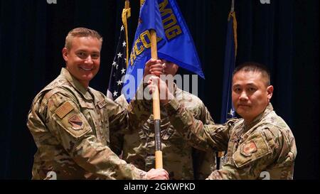 Col. Christian Lyons (left), 88th Medical Group commander, passes the ...