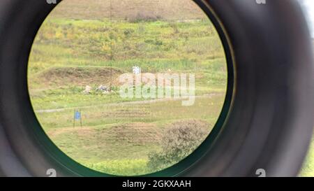 A target as seen through a spotting scope of an instructor from the ...