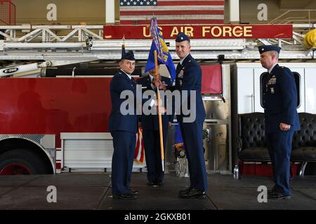 A group of 319th Civil Engineering Squadron firefighters stand in a ...