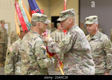 Col. Sean Flynn, commander of the 27th Infantry Brigade Combat Team, speaks with Staff Sgt ...