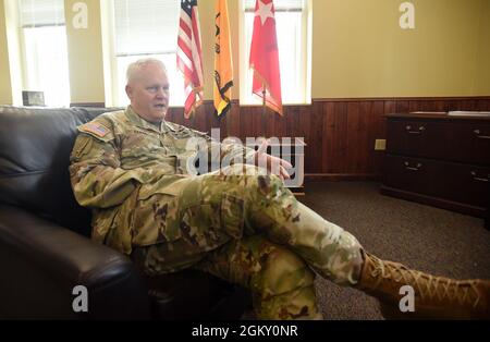 Maj. Gen. John Evans, commander of U.S. Army Cadet Command, presents Victoria Sanelli with a two ...