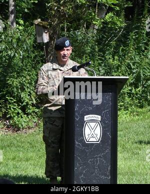 A 548th Combat Sustainment Support Battalion Soldier (middle) embraces ...