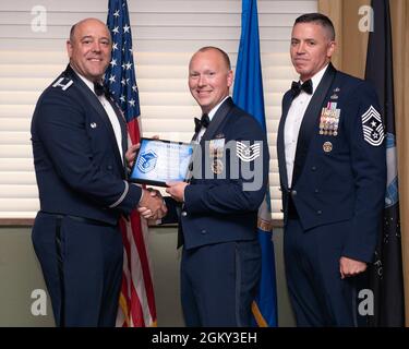 A promotee poses for a photo with Col. Patrick Miller, 88th Air Base ...