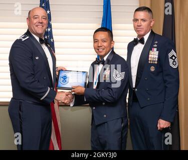 A promotee poses for a photo with Col. Patrick Miller, 88th Air Base ...