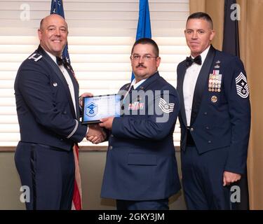 A promotee poses for a photo with Col. Patrick Miller, 88th Air Base ...