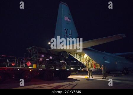 U.S. Marines and Airmen unload an AN/TPS-80 Ground/Air Task Oriented ...