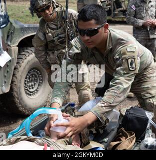 A U.S. Army medic assigned to 173rd Airborne Brigade participates in an ...