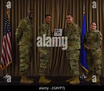 Col. Timothy Curry, 319th Reconnaissance Wing commander, presents ...