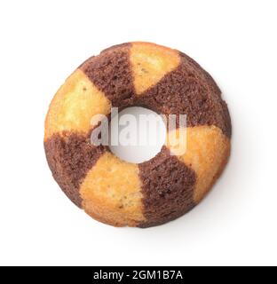 Top view of a sponge lemon cake on a table next to other plates with ...