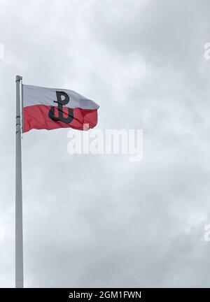 Polish flag with the symbol of Polish Fighting. Symbol of the Warsaw ...