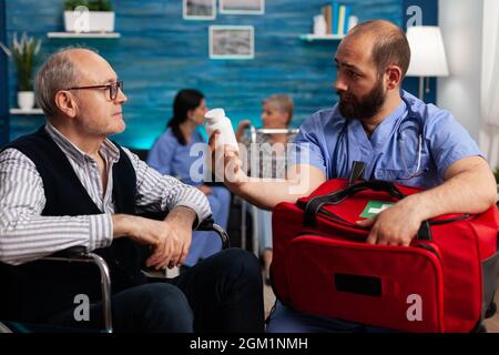 Hands of social worker explaining senior woman where to sign document ...