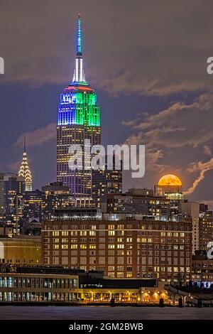 Empire State Building and Chrysler Building rising from ocean Stock ...