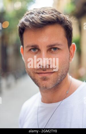 Handsome good looking brunet unshaven man with beard wearing casual ...